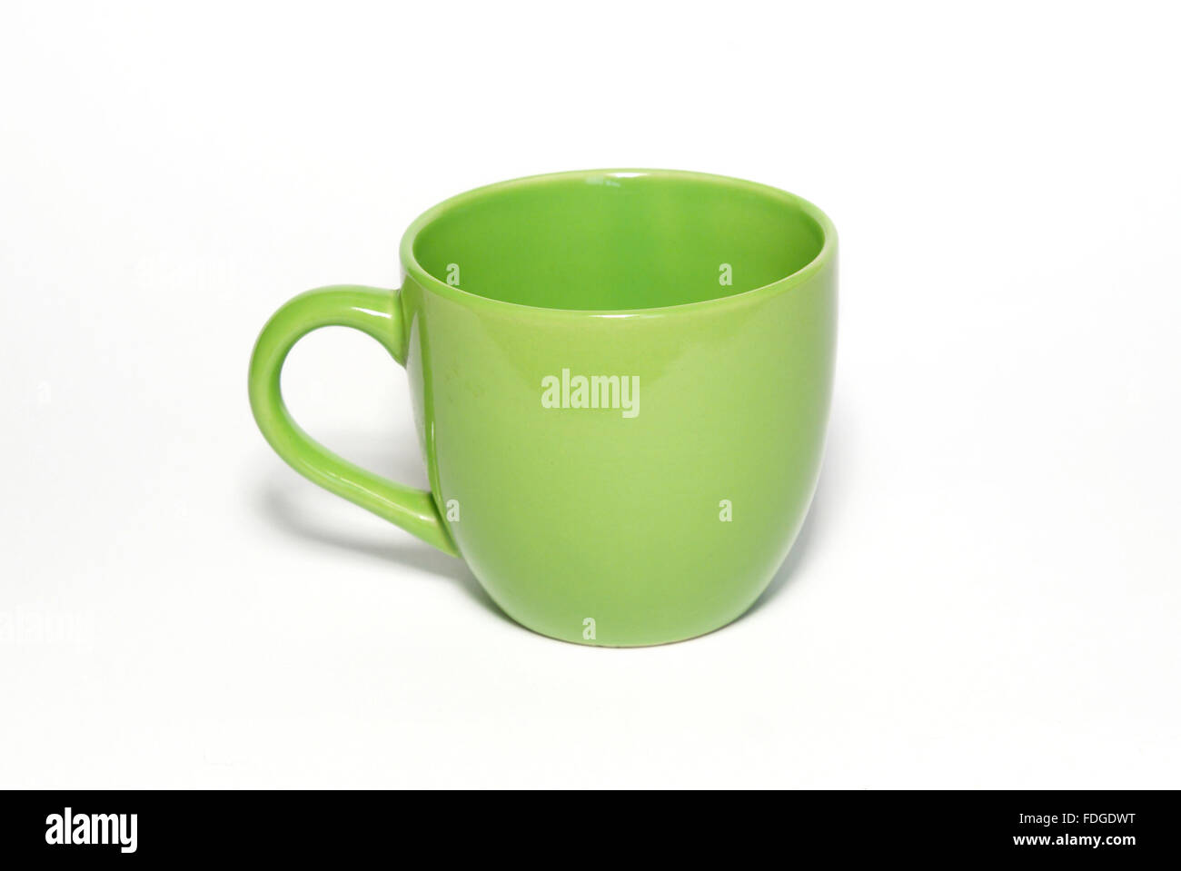 Green teacup isolated in white Stock Photo - Alamy