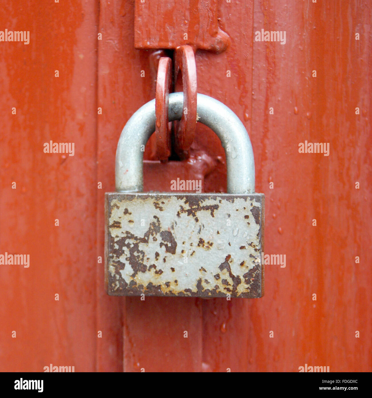 Lock on the red door Stock Photo - Alamy