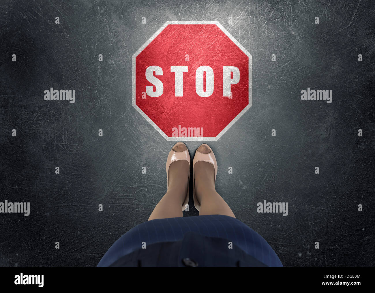 Top view of businesswoman feet and stop sign Stock Photo - Alamy