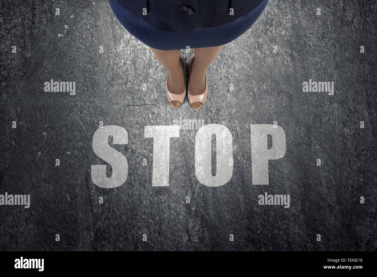 Top view of businesswoman feet and stop sign Stock Photo - Alamy