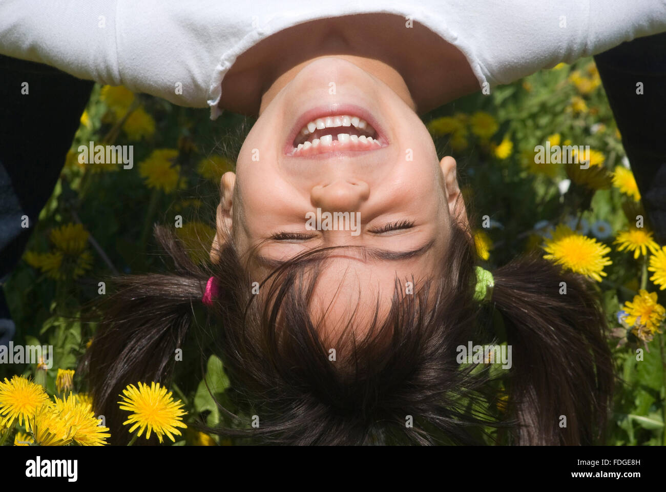 Girl upside down play hi-res stock photography and images - Alamy