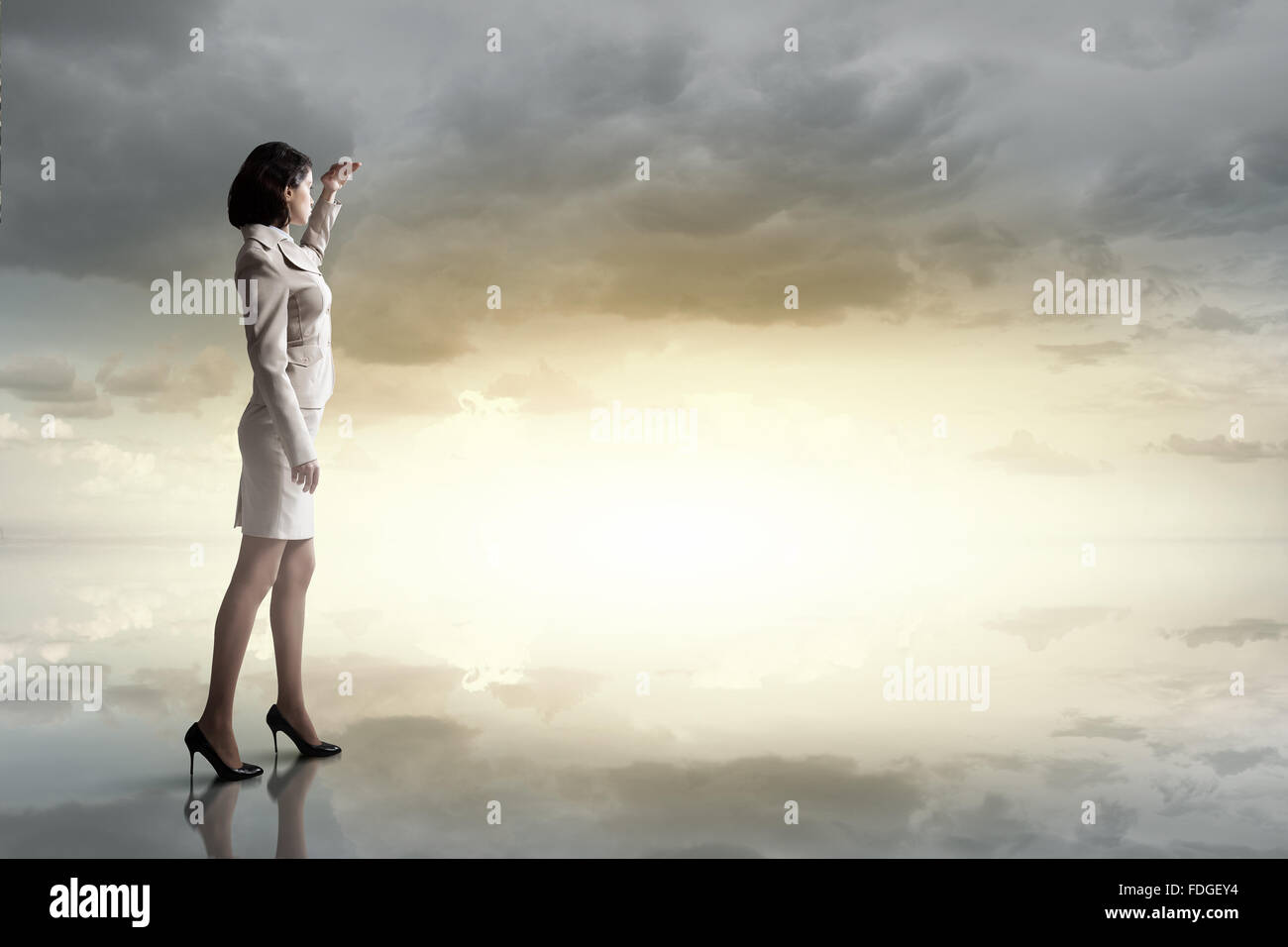 Young businesswoman looking forward on sunrise at horison Stock Photo ...