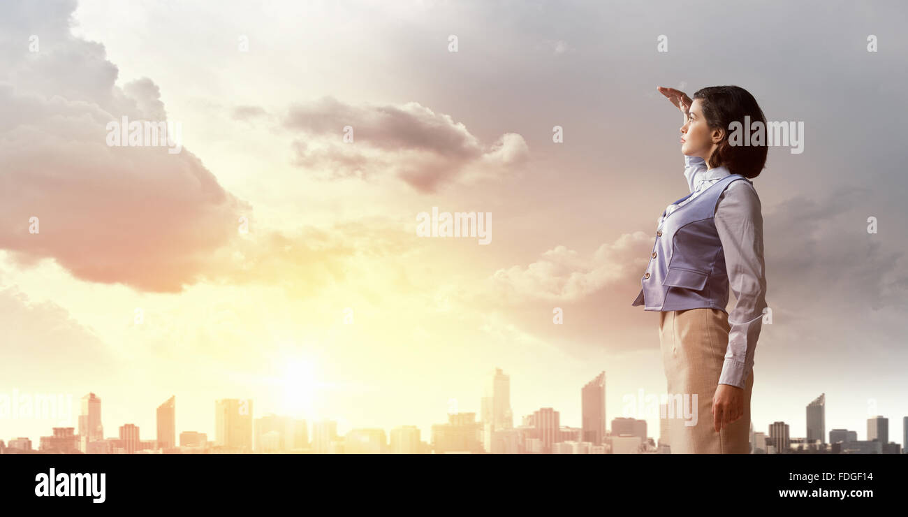 Young businesswoman looking forward on sunrise at horison Stock Photo ...