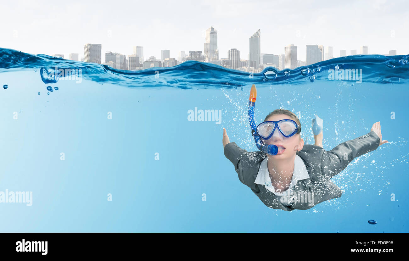 Young businesswoman in suit and diving mask swimming under water Stock ...