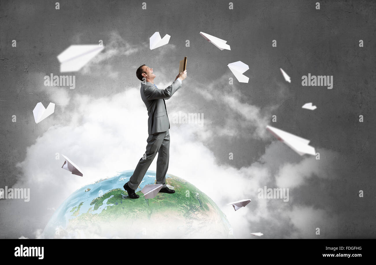 Young handsome businessman with old book in hands Stock Photo - Alamy