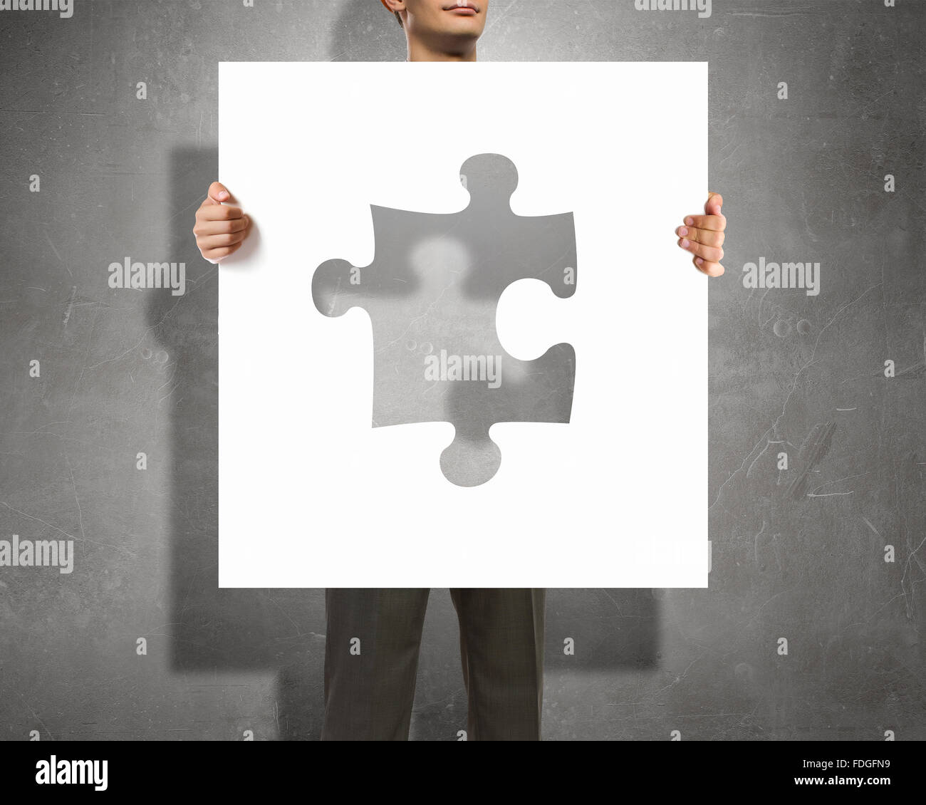 Businessman hiding his face behind paper sheet with sketches Stock ...