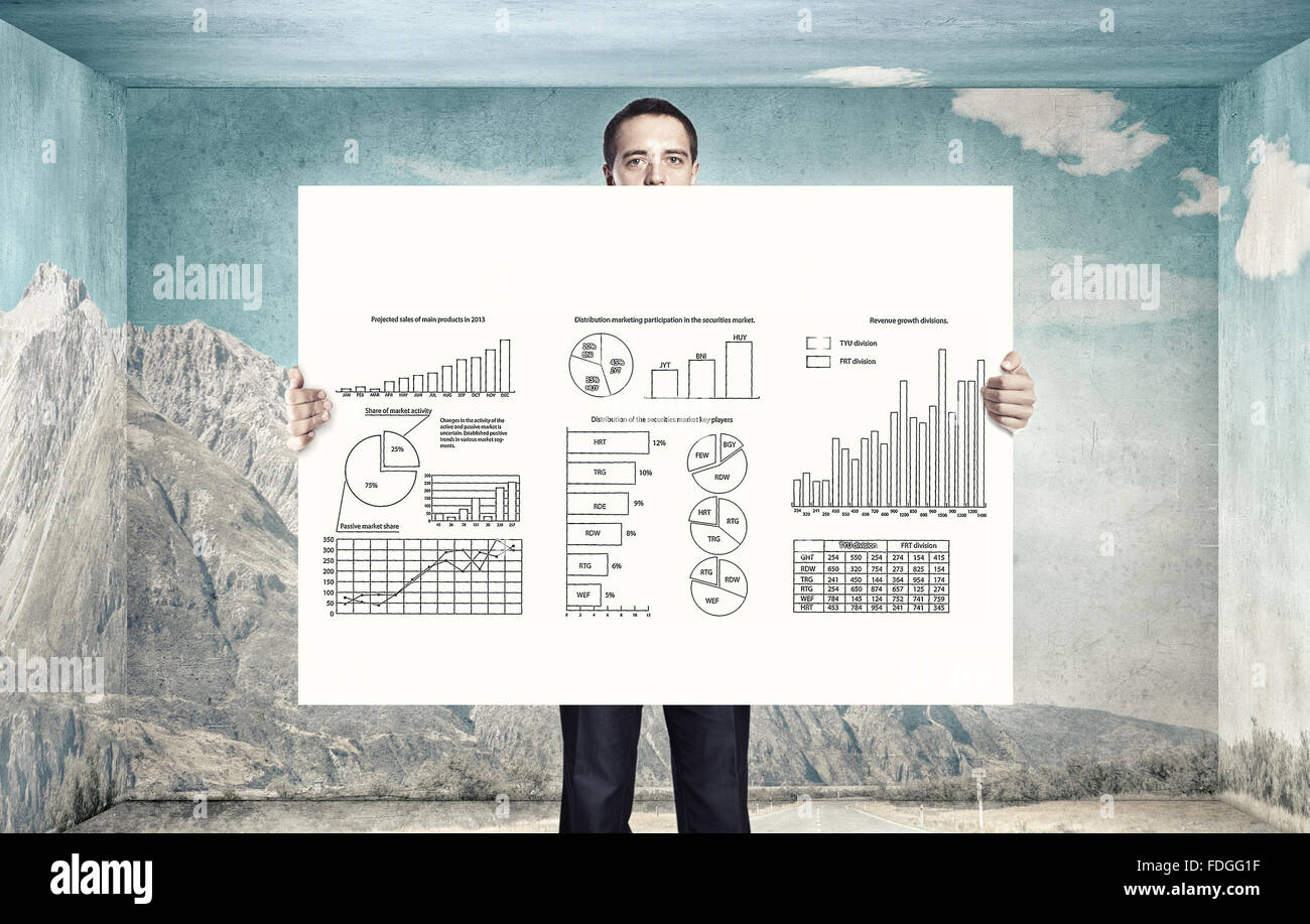 Businessman holding banner with graphs and diagrams concept Stock Photo ...