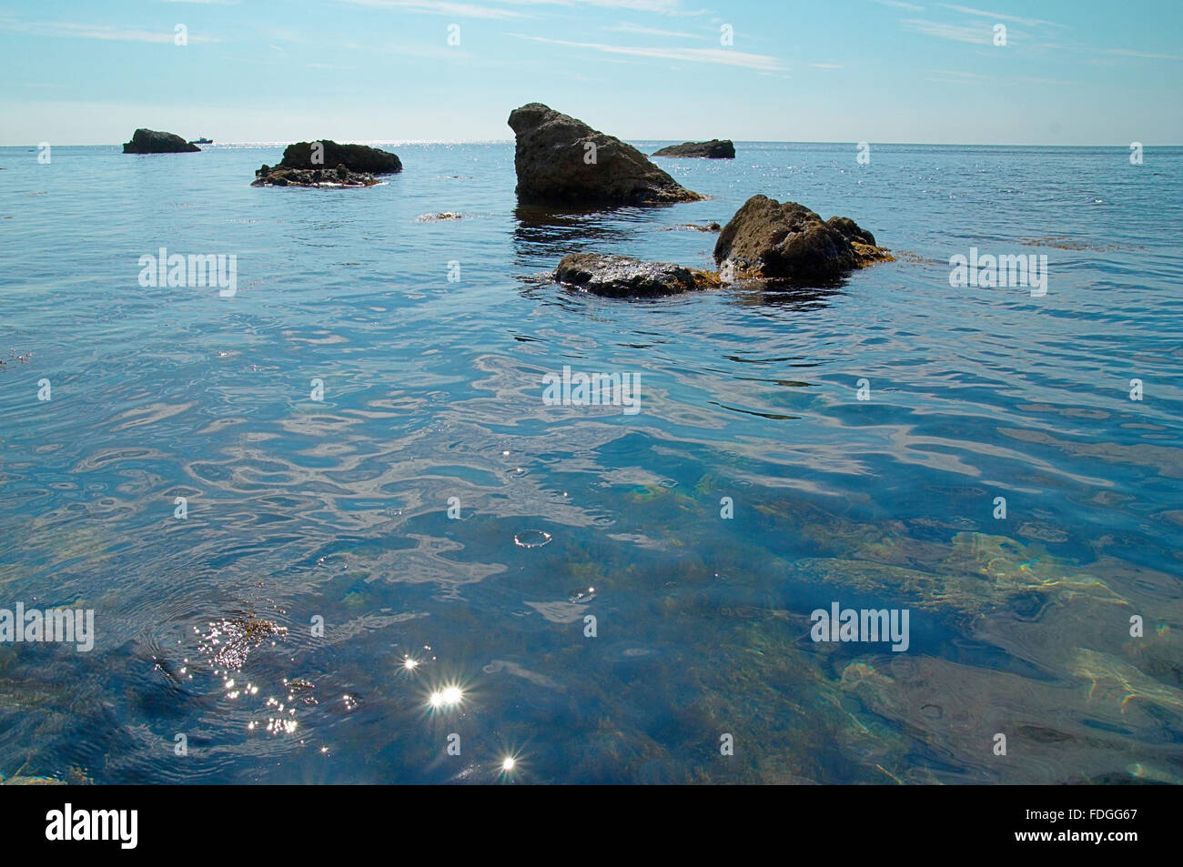 Sea landscape with rocks and water surface Stock Photo - Alamy