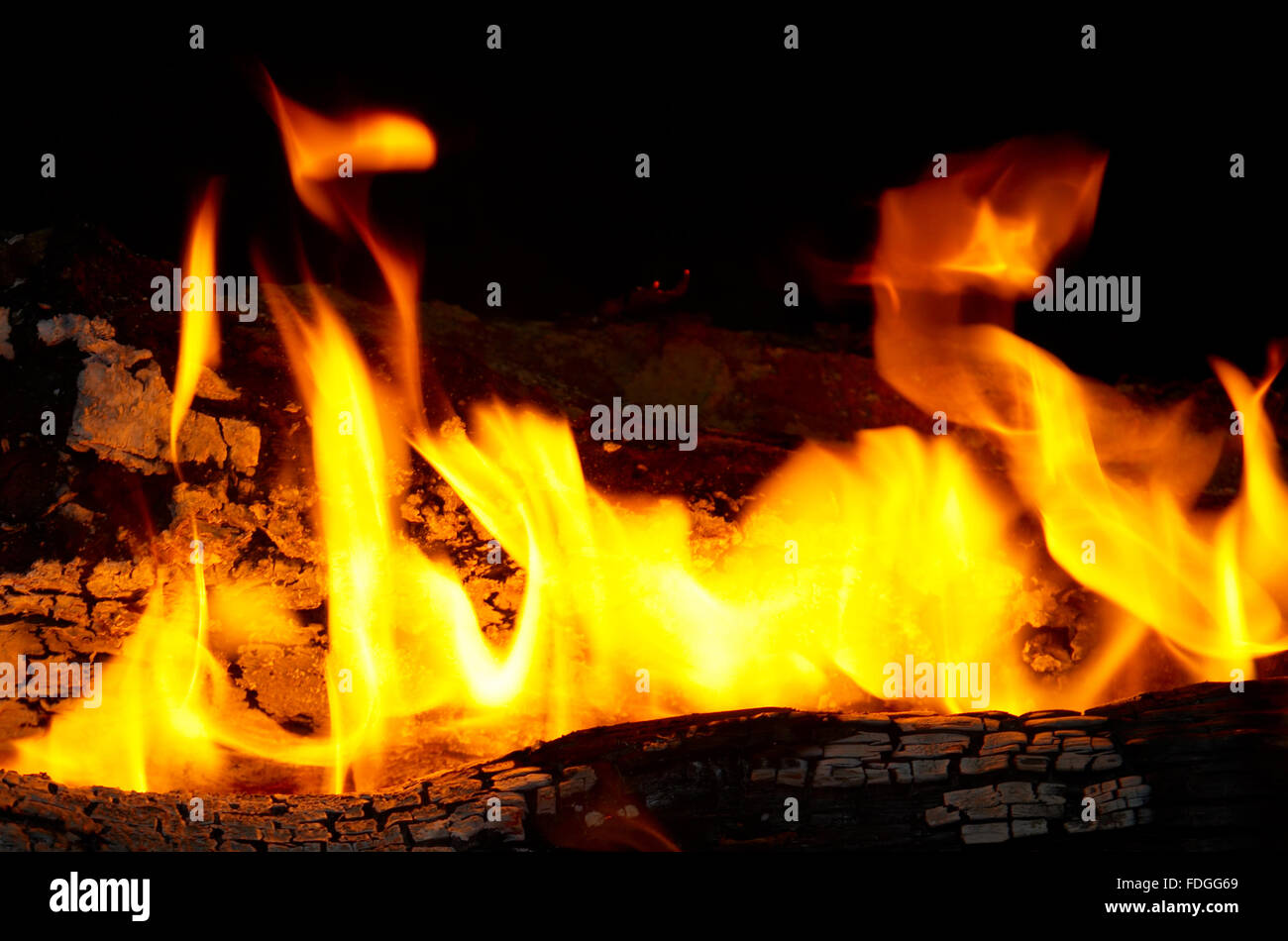 Flame tips on the firewood Stock Photo - Alamy