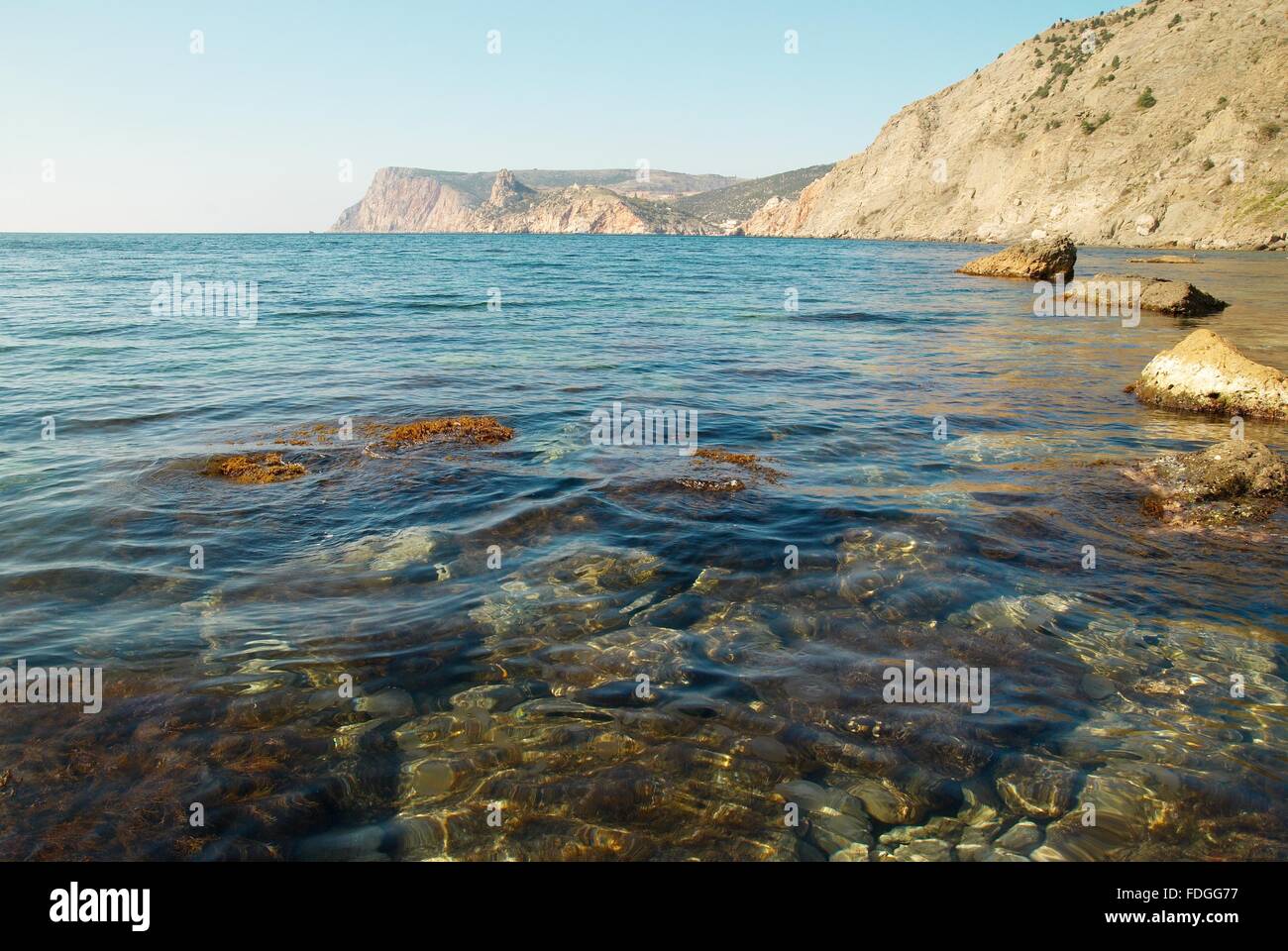 Sea landscape with rocks and water surface Stock Photo - Alamy