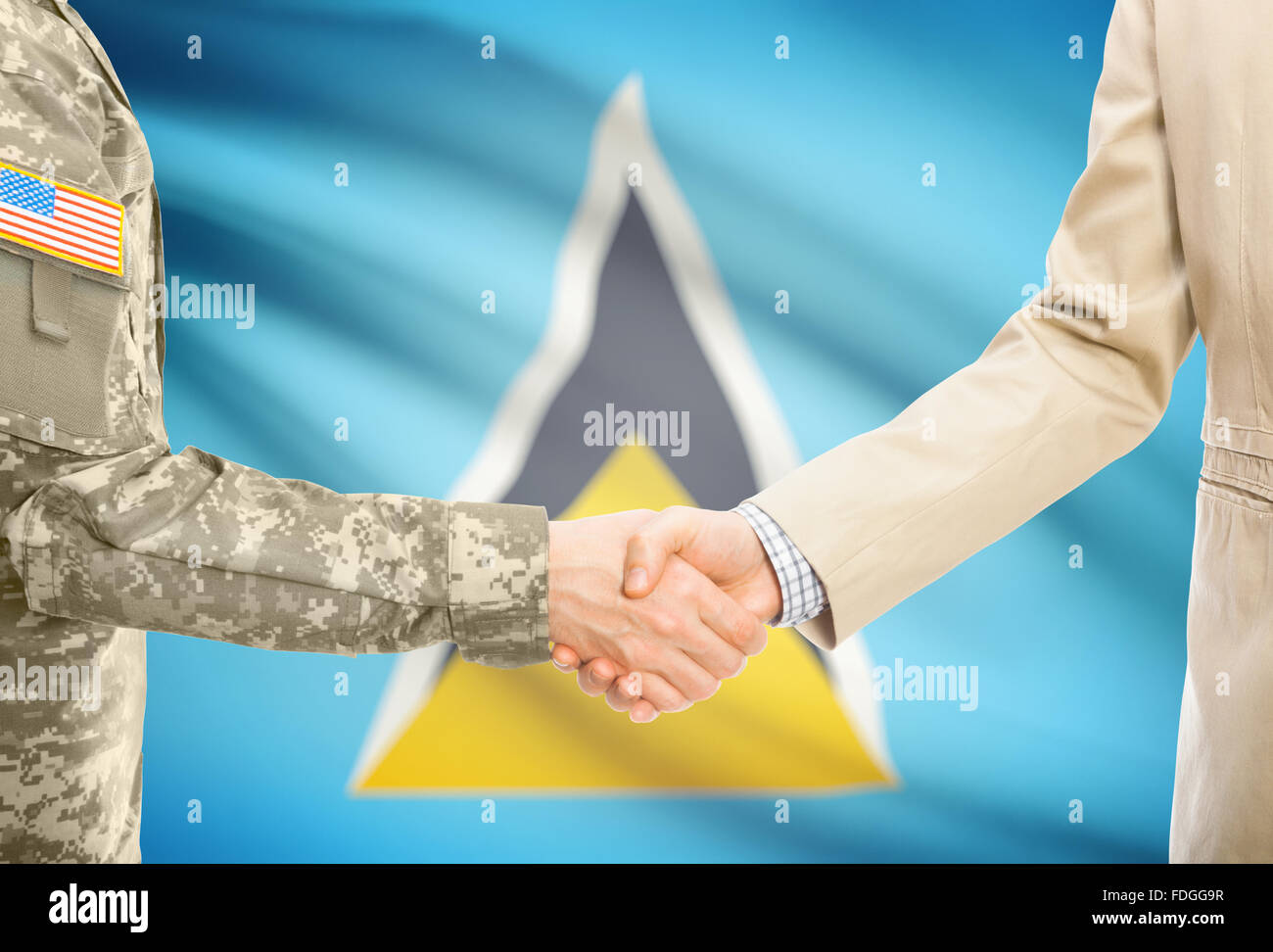 American soldier in uniform and civil man in suit shaking hands with ...
