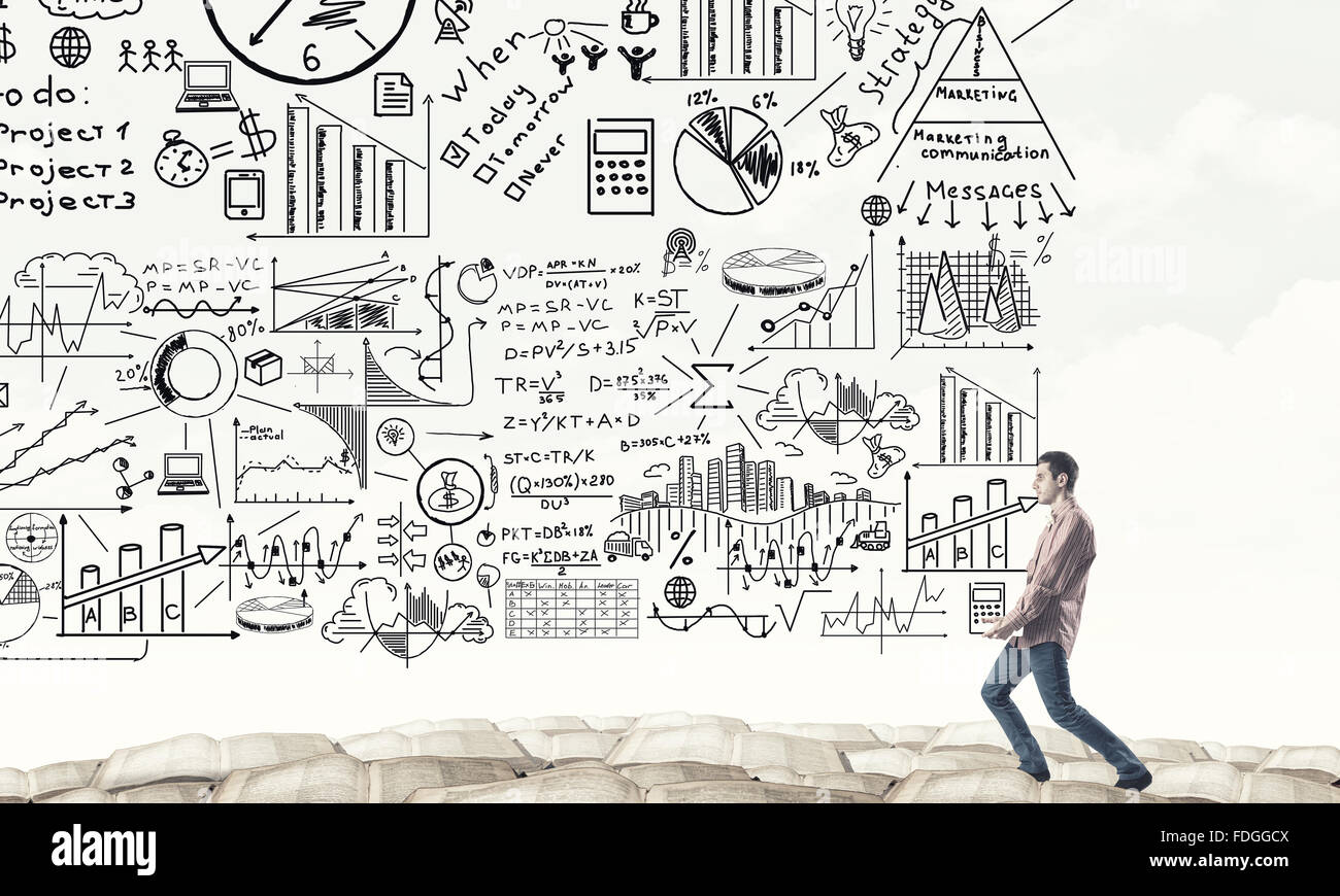 Young man carrying banner with his great business plan Stock Photo - Alamy