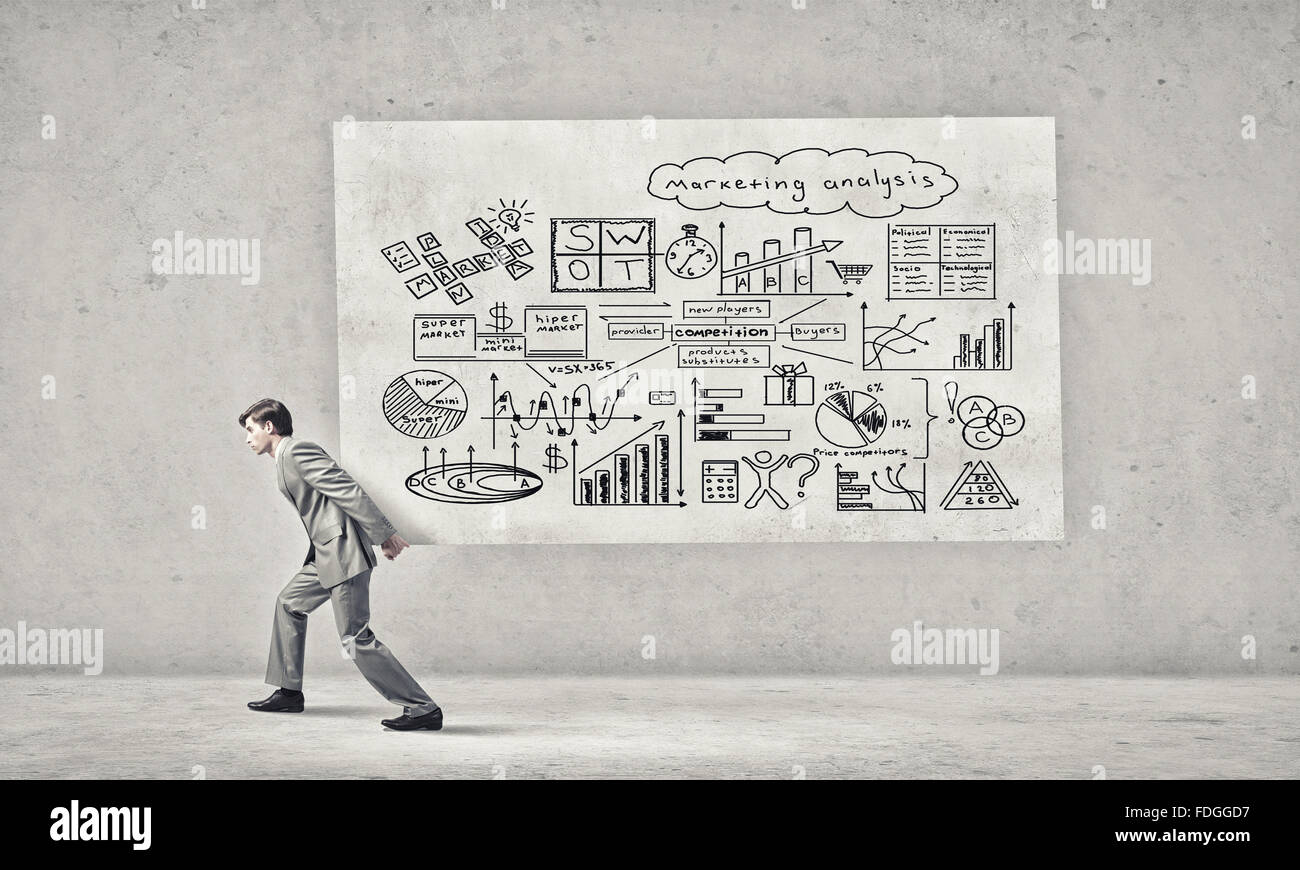 Young businessman carrying banner with his great business plan Stock ...