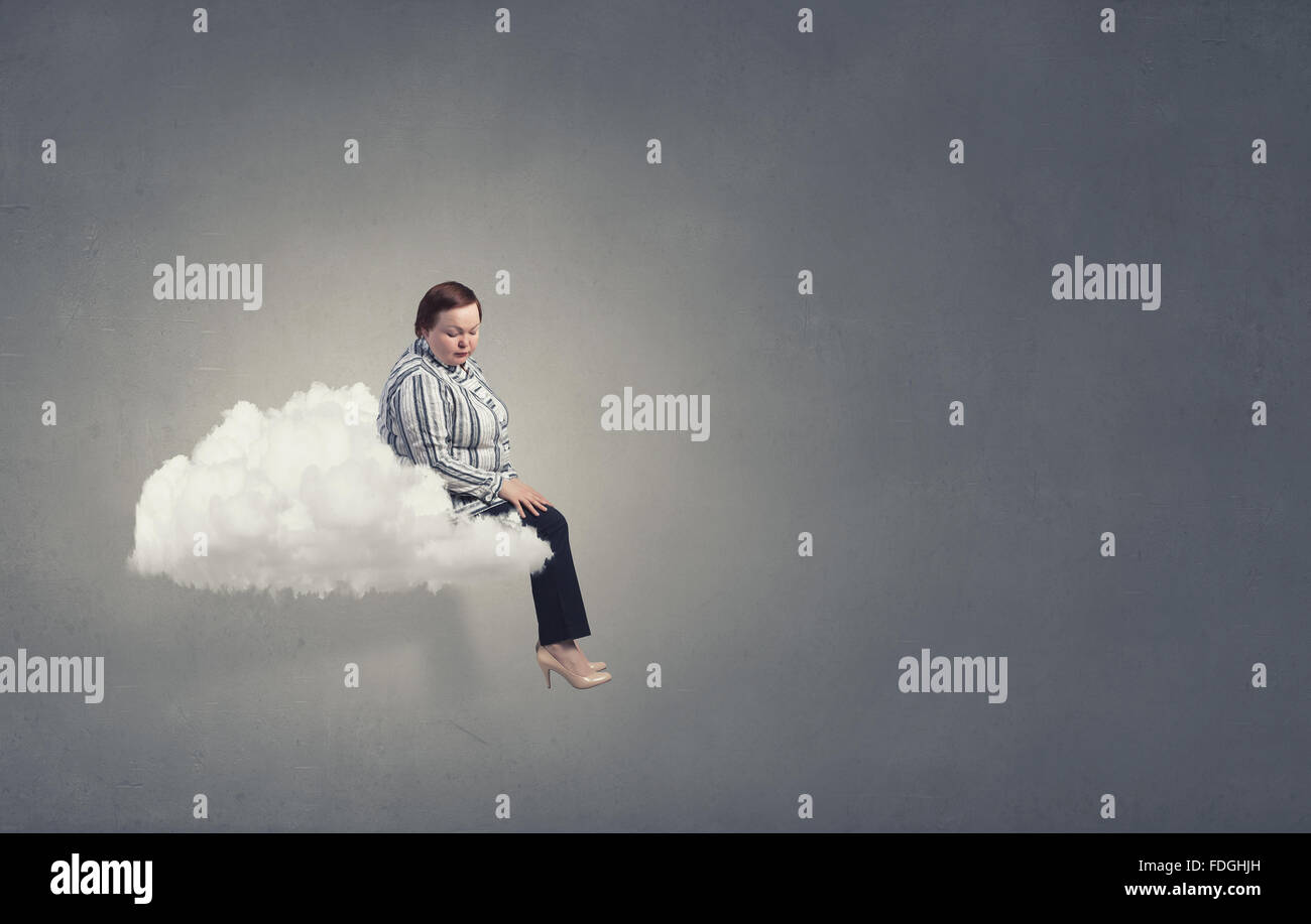 Plus size woman in casual sitting on cloud Stock Photo - Alamy