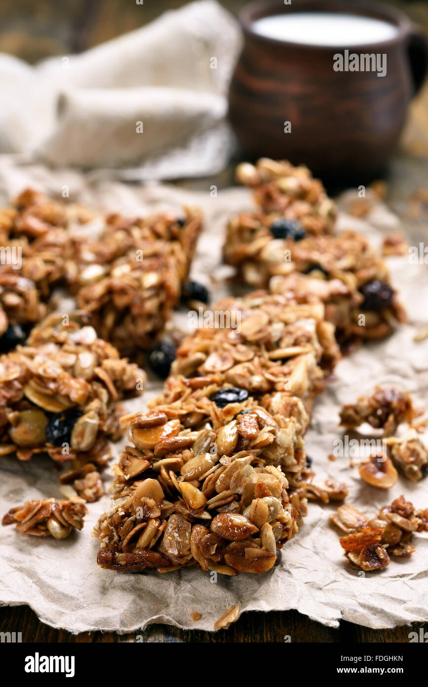 Muesli bars on paper, close up view Stock Photo - Alamy