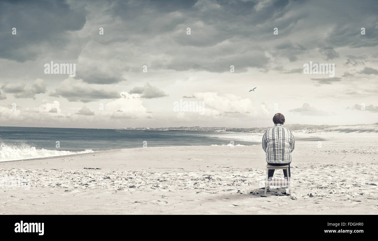 Middle aged stout woman sitting with back Stock Photo - Alamy