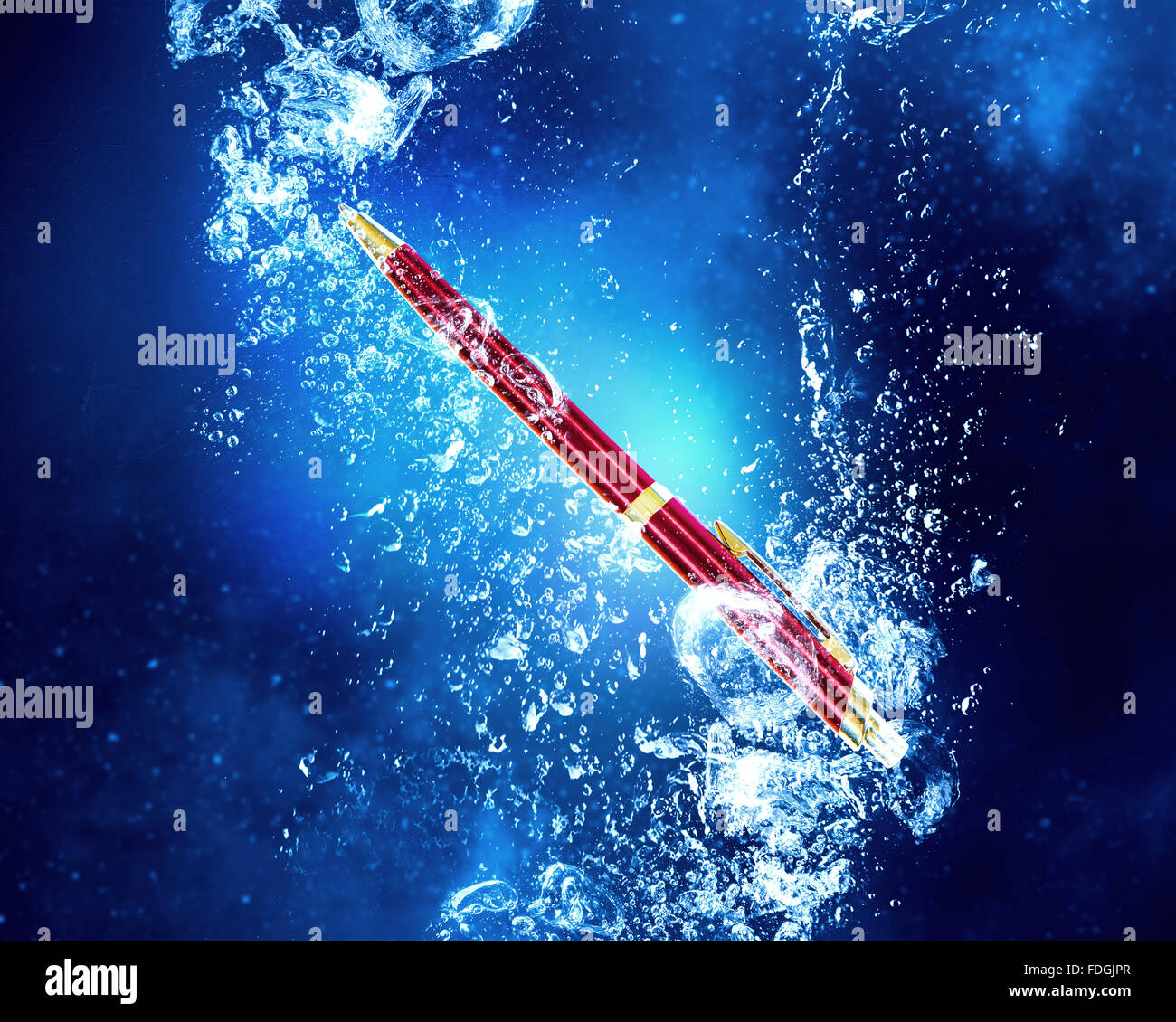 Fountain pen sink in clear blue water Stock Photo - Alamy