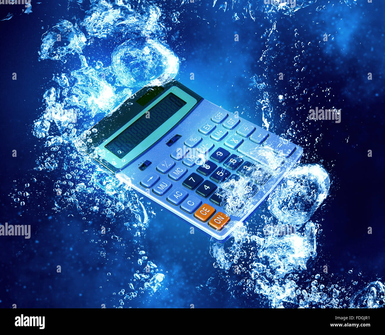 Calculator item sink in clear blue water Stock Photo - Alamy