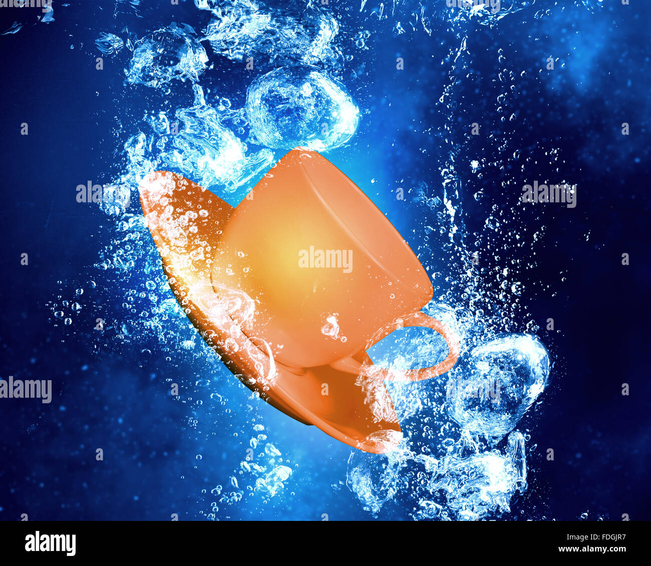 Tea cup sink in clear blue water Stock Photo - Alamy