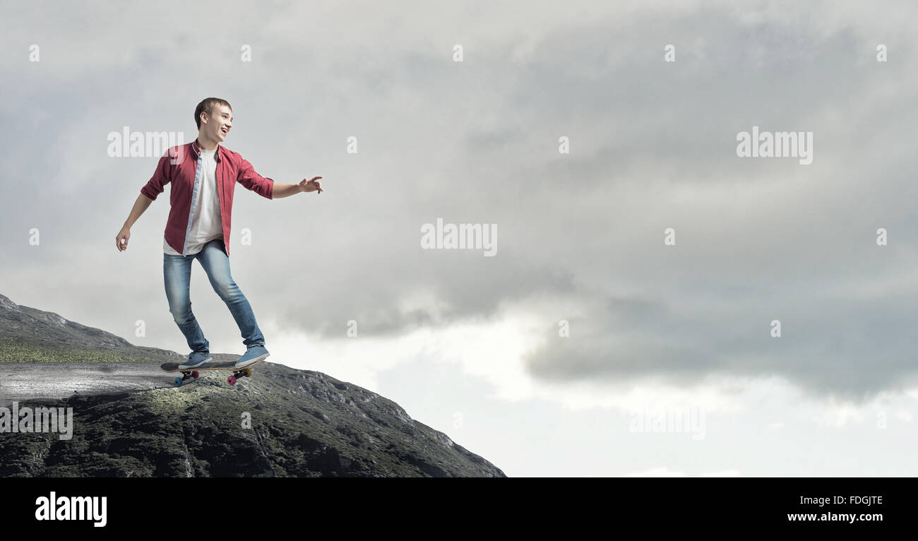 Handsome teenager cool acive boy riding skateboard Stock Photo - Alamy