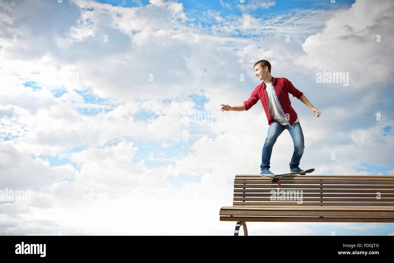 Handsome teenager cool acive boy riding skateboard Stock Photo - Alamy