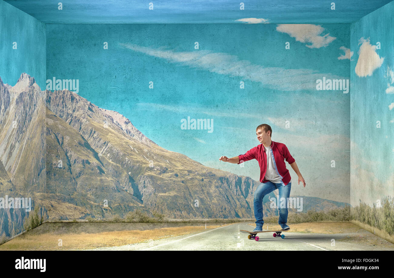 Handsome teenager cool acive boy riding skateboard Stock Photo - Alamy