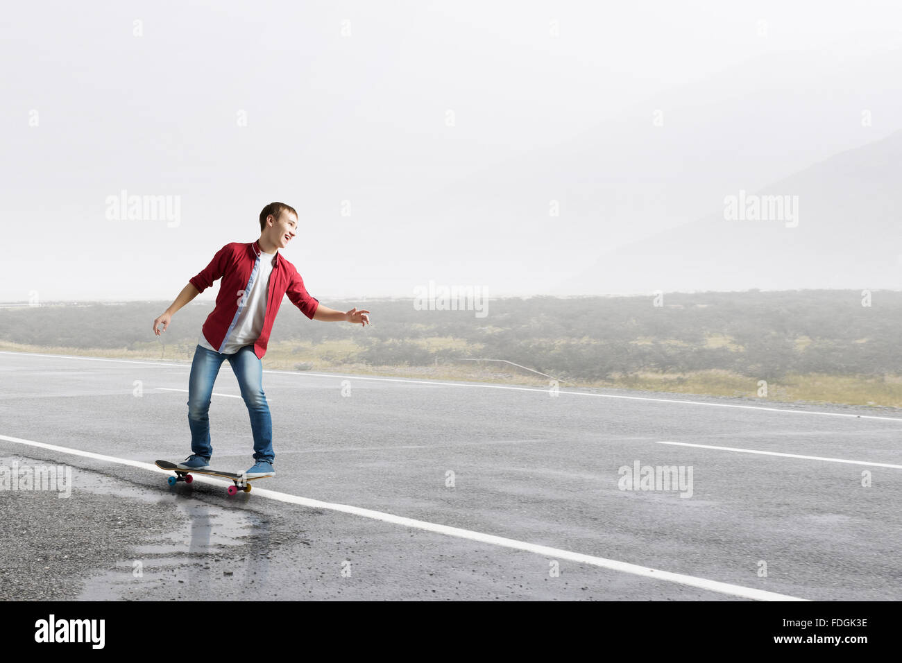 Handsome teenager cool acive boy riding skateboard Stock Photo - Alamy