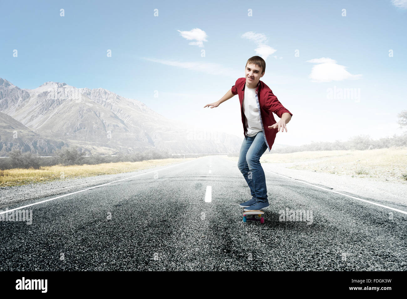 Handsome teenager cool acive boy riding skateboard Stock Photo - Alamy
