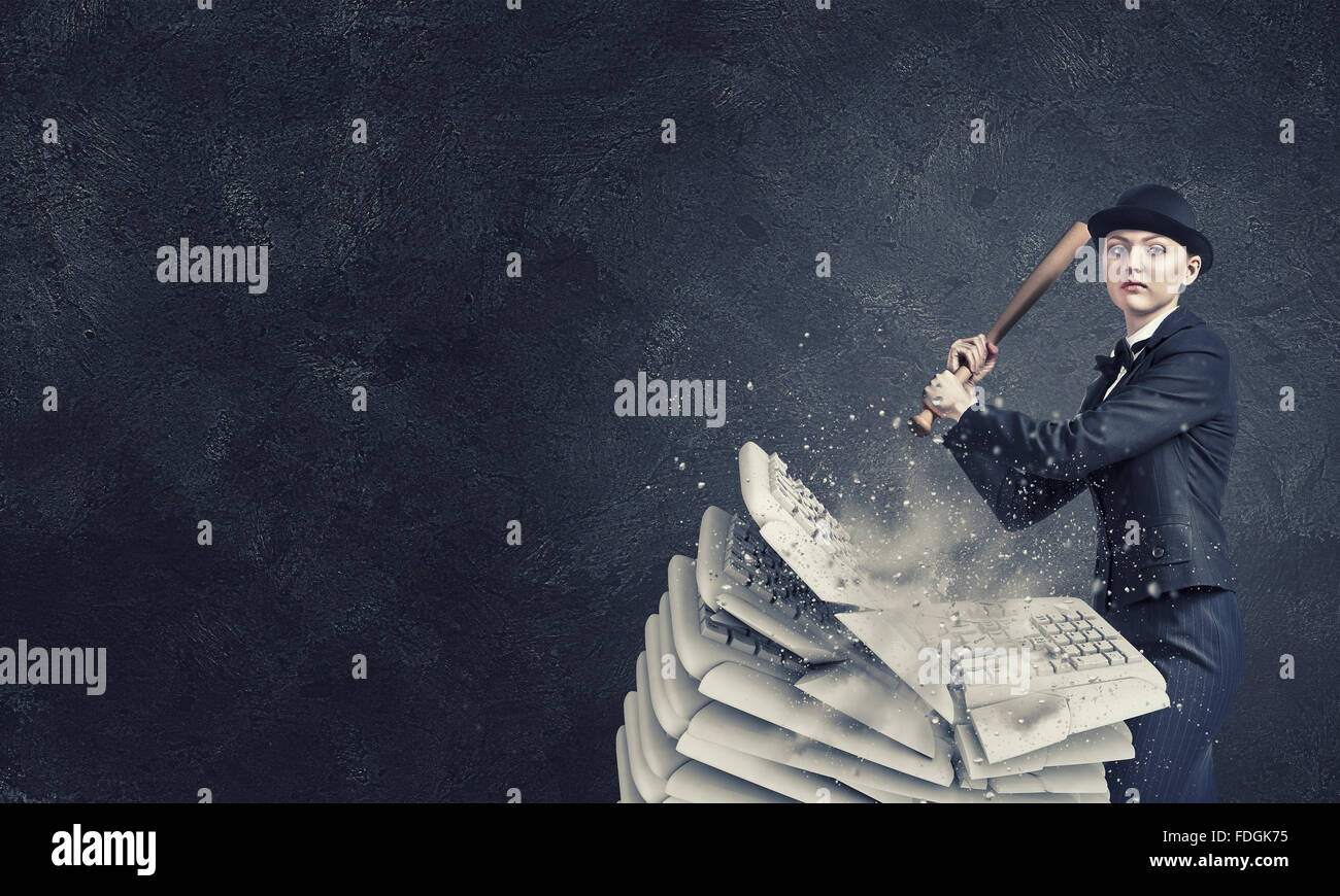 Young crazy woman damaging computer keyboards with baseball bat Stock ...