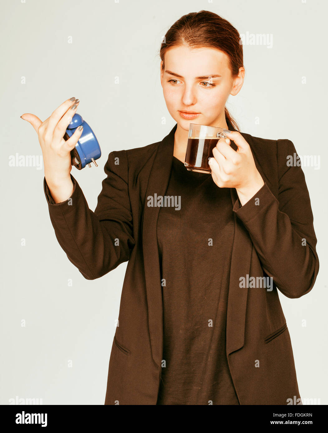 young beauty woman in business style costume waking up for work early ...