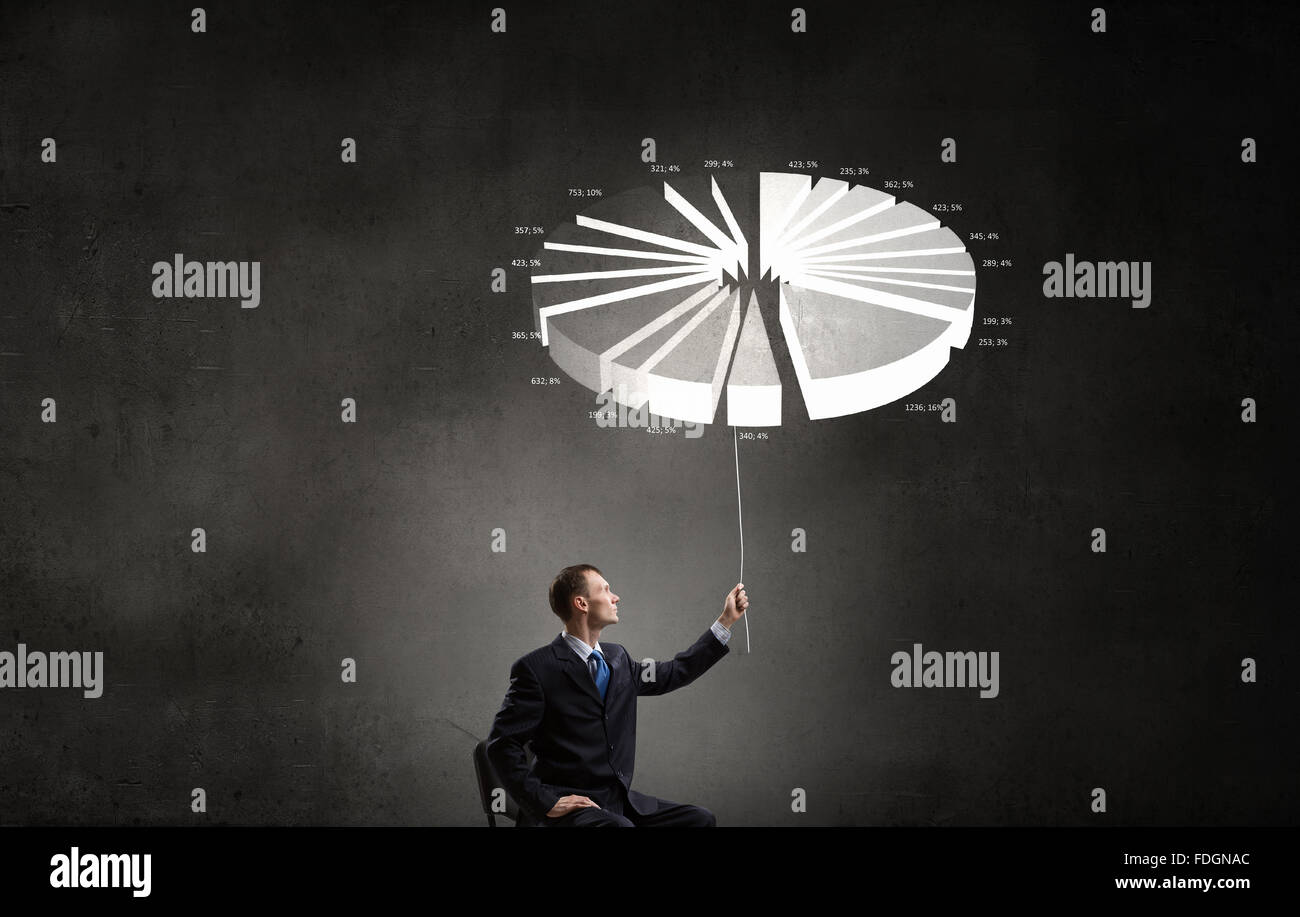 Businessman in chair holding diagram pie on rope Stock Photo - Alamy