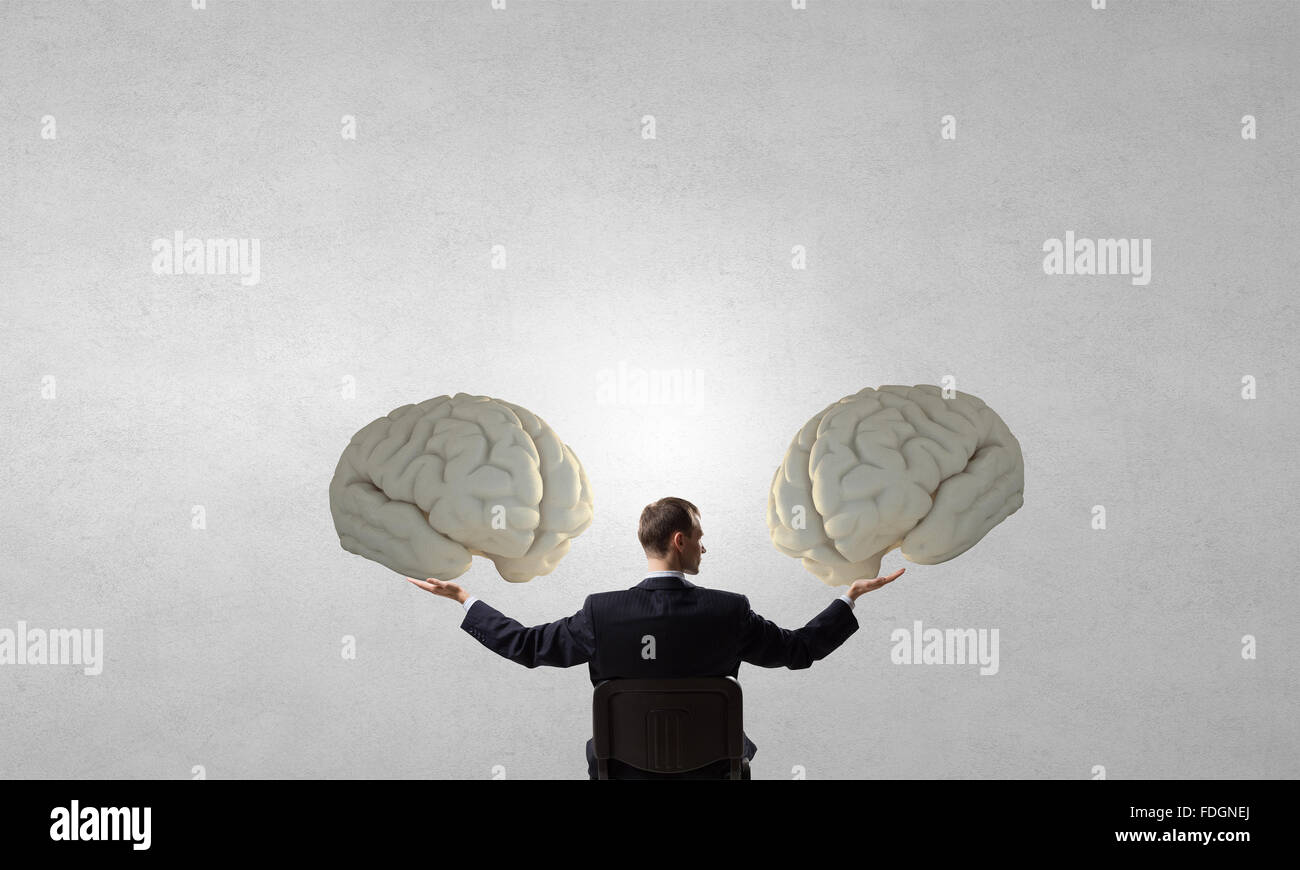 Back view of businessman sitting in chair and mind concept Stock Photo ...