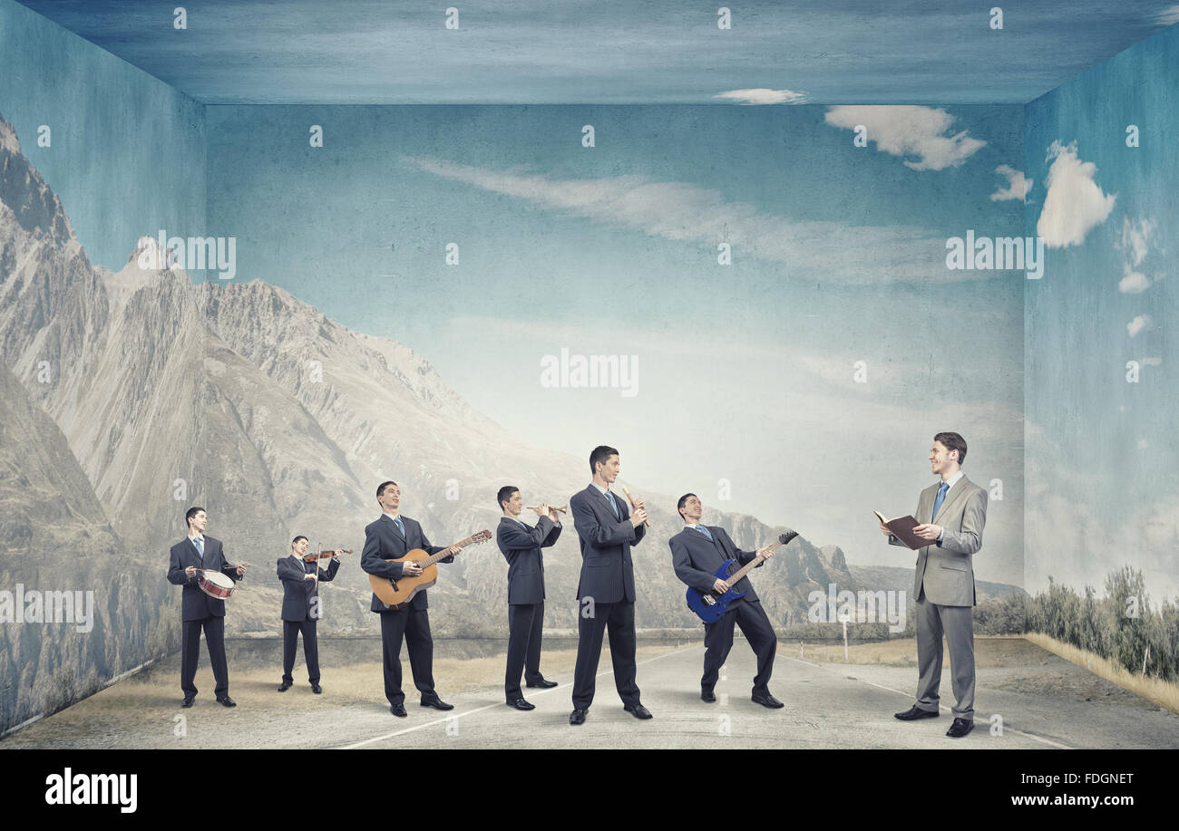 Man orchestra in suit playing different music instruments Stock Photo ...