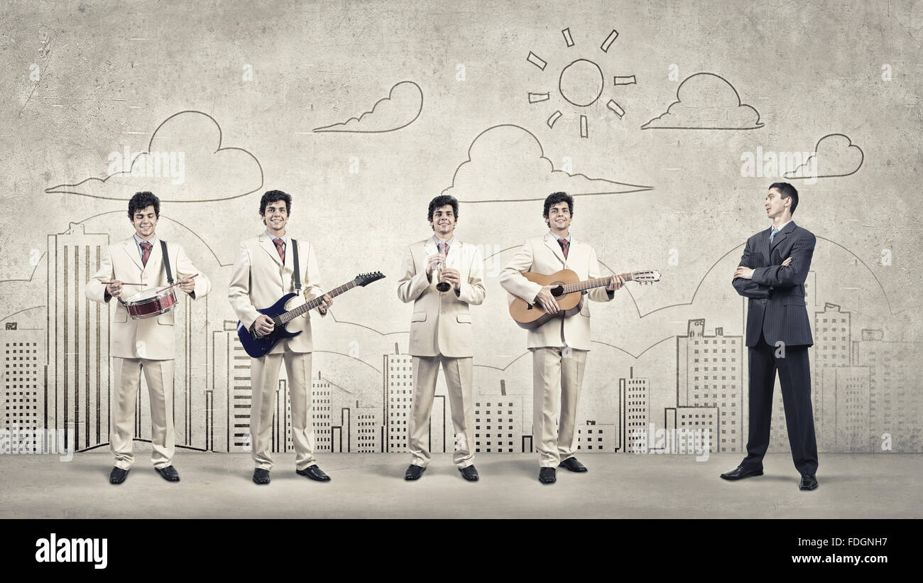 Man orchestra in suit playing different music instruments Stock Photo ...