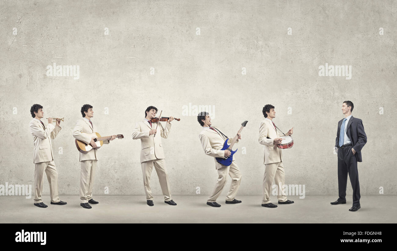 Man orchestra in suit playing different music instruments Stock Photo ...