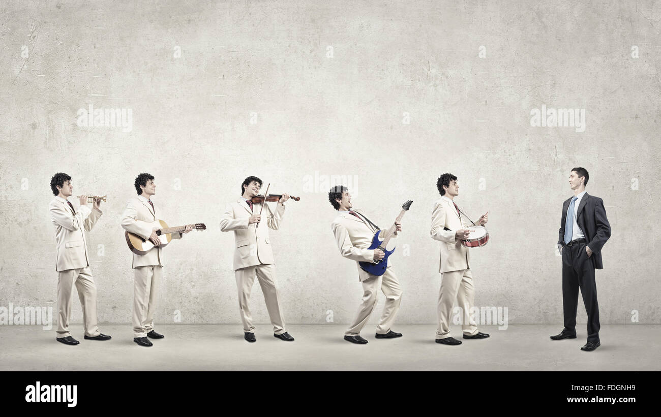 Man orchestra in suit playing different music instruments Stock Photo ...