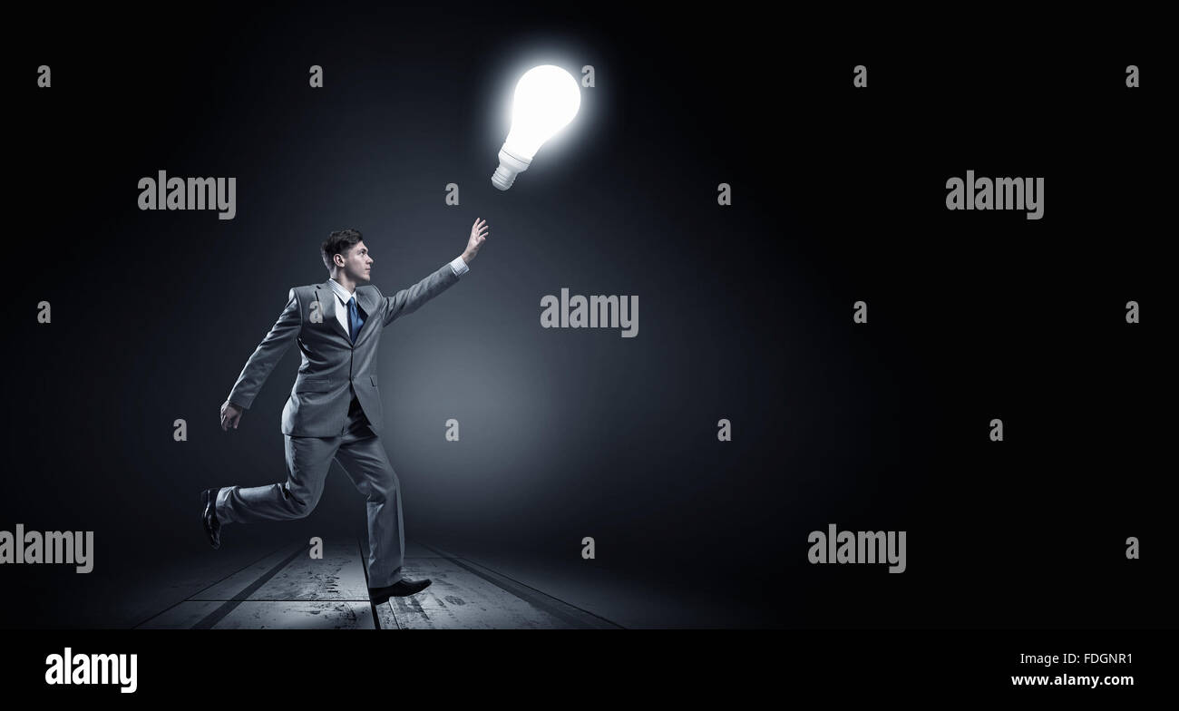 Running man light suit hi-res stock photography and images - Alamy