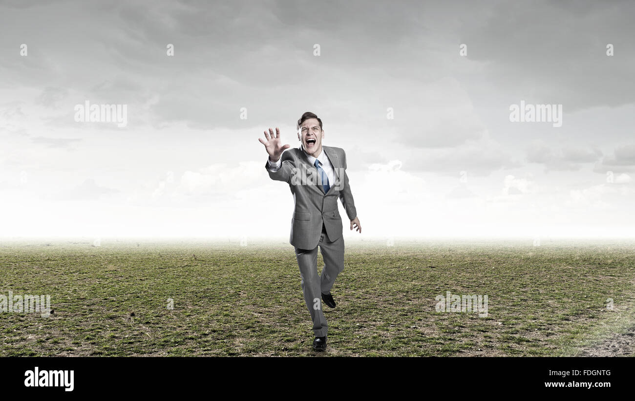 Young businessman running and tryinhg to catch up with something Stock ...