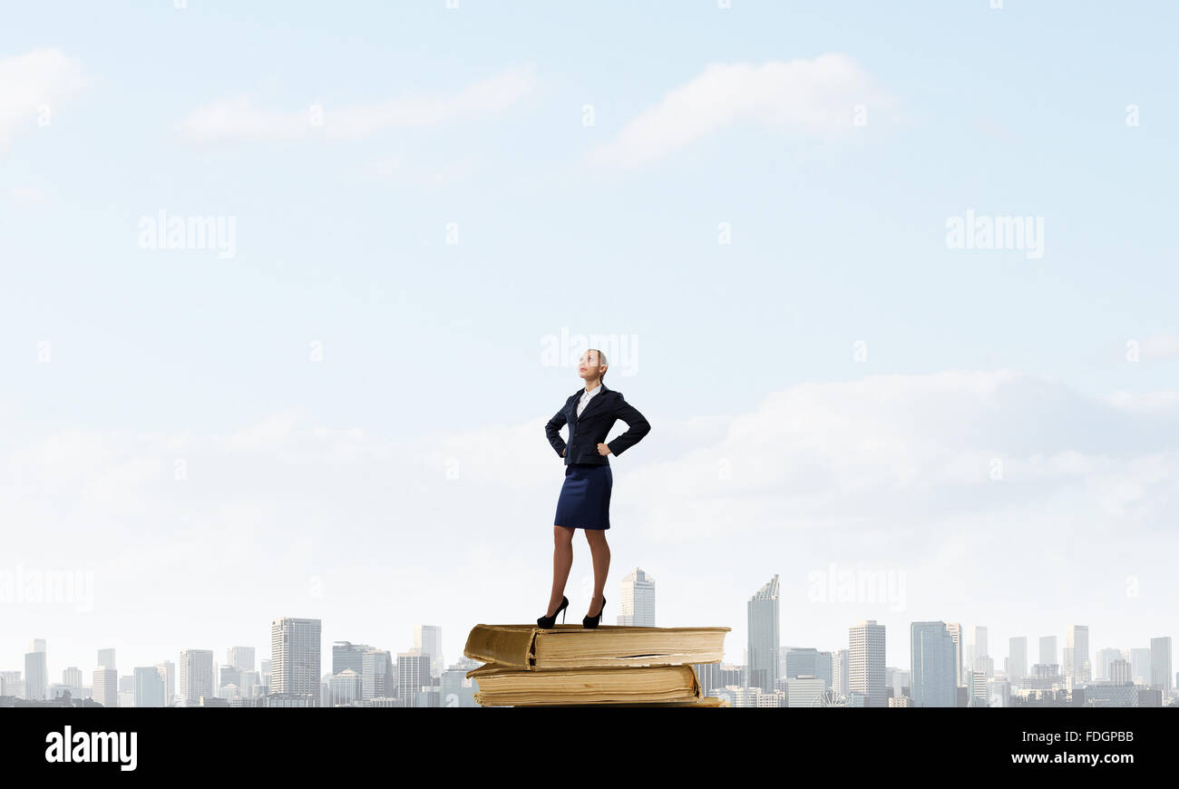 Standing on books pile hi-res stock photography and images - Alamy