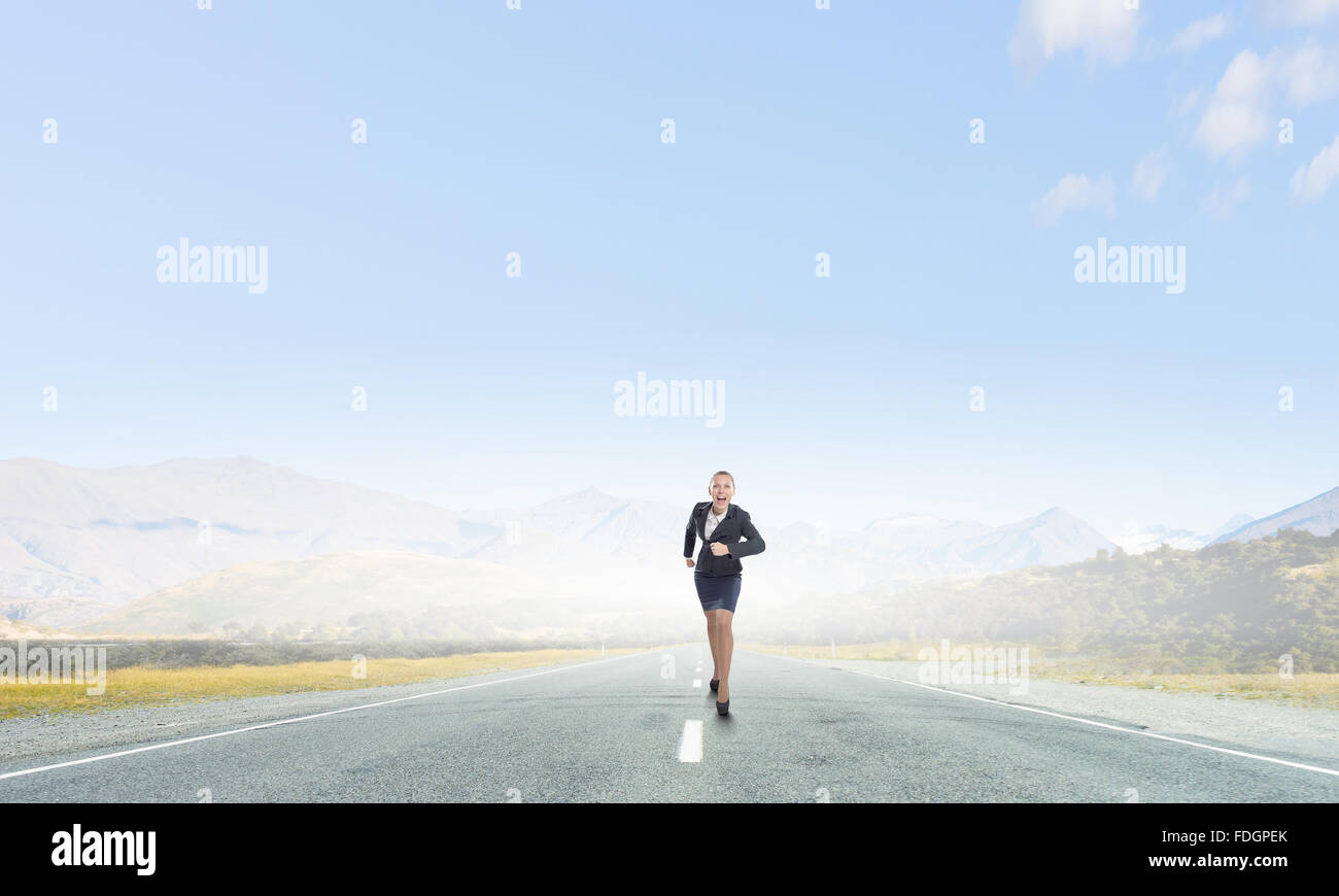 Young determined businesswoman competitor running on road Stock Photo - Alamy
