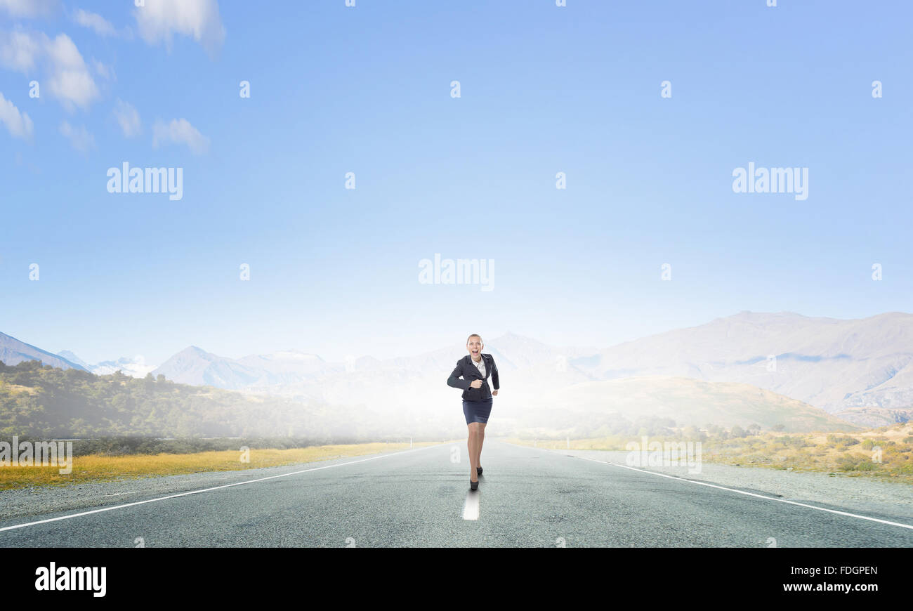 Young determined businesswoman competitor running on road Stock Photo - Alamy