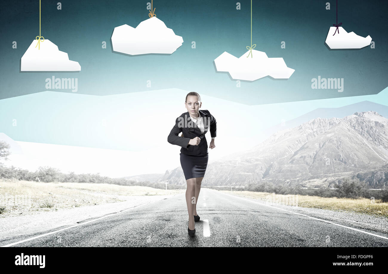 Young determined businesswoman competitor running on road Stock Photo ...