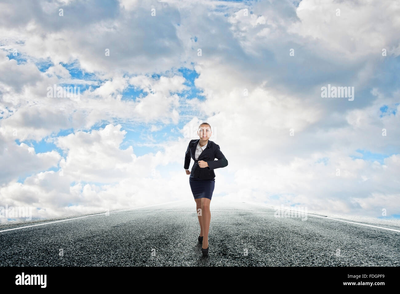 Young determined businesswoman competitor running on road Stock Photo ...