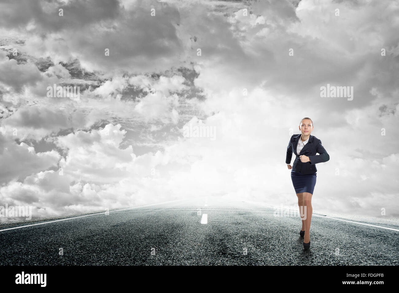 Young determined businesswoman competitor running on road Stock Photo ...