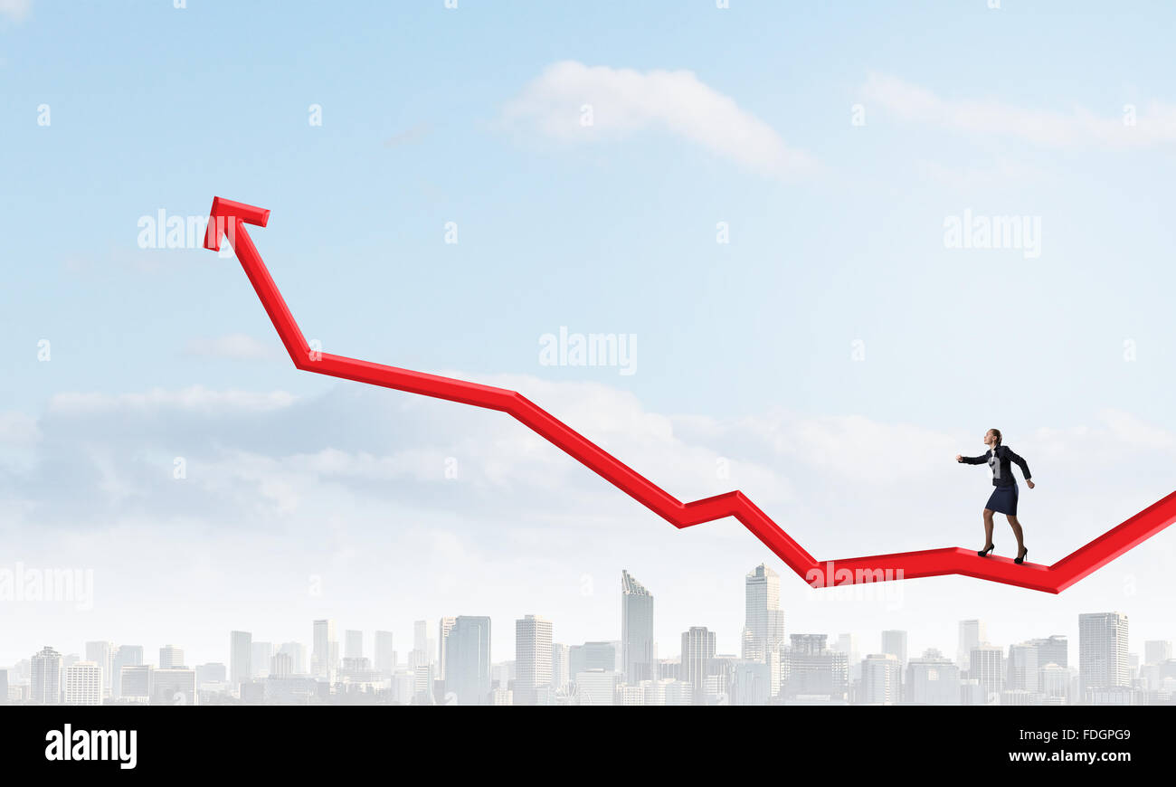Young businesswoman running up on increasing arrow graph Stock Photo ...