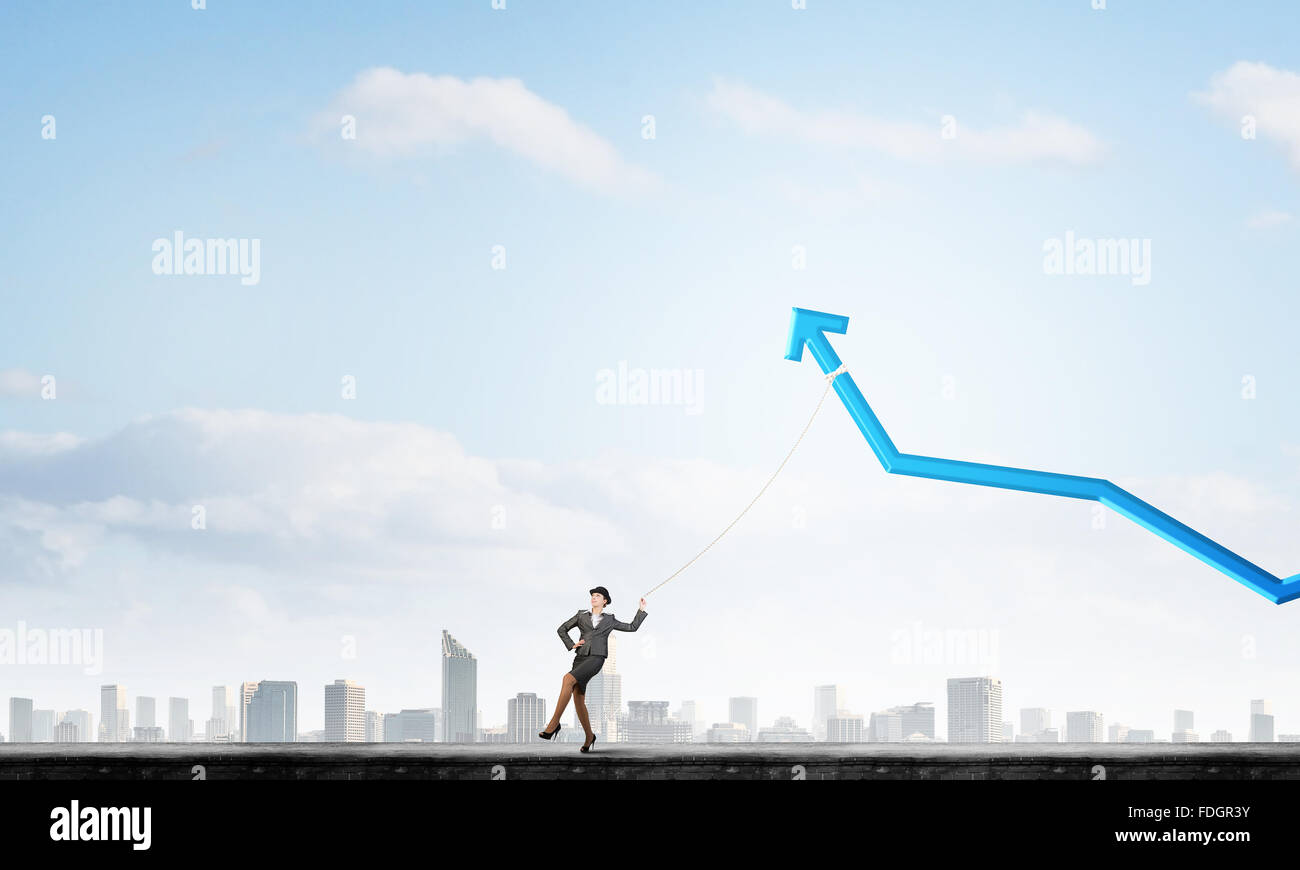 Businesswoman pulling arrow with rope and making it raise up Stock ...