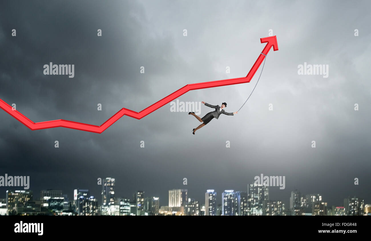 Businesswoman pulling arrow with rope and making it raise up Stock ...