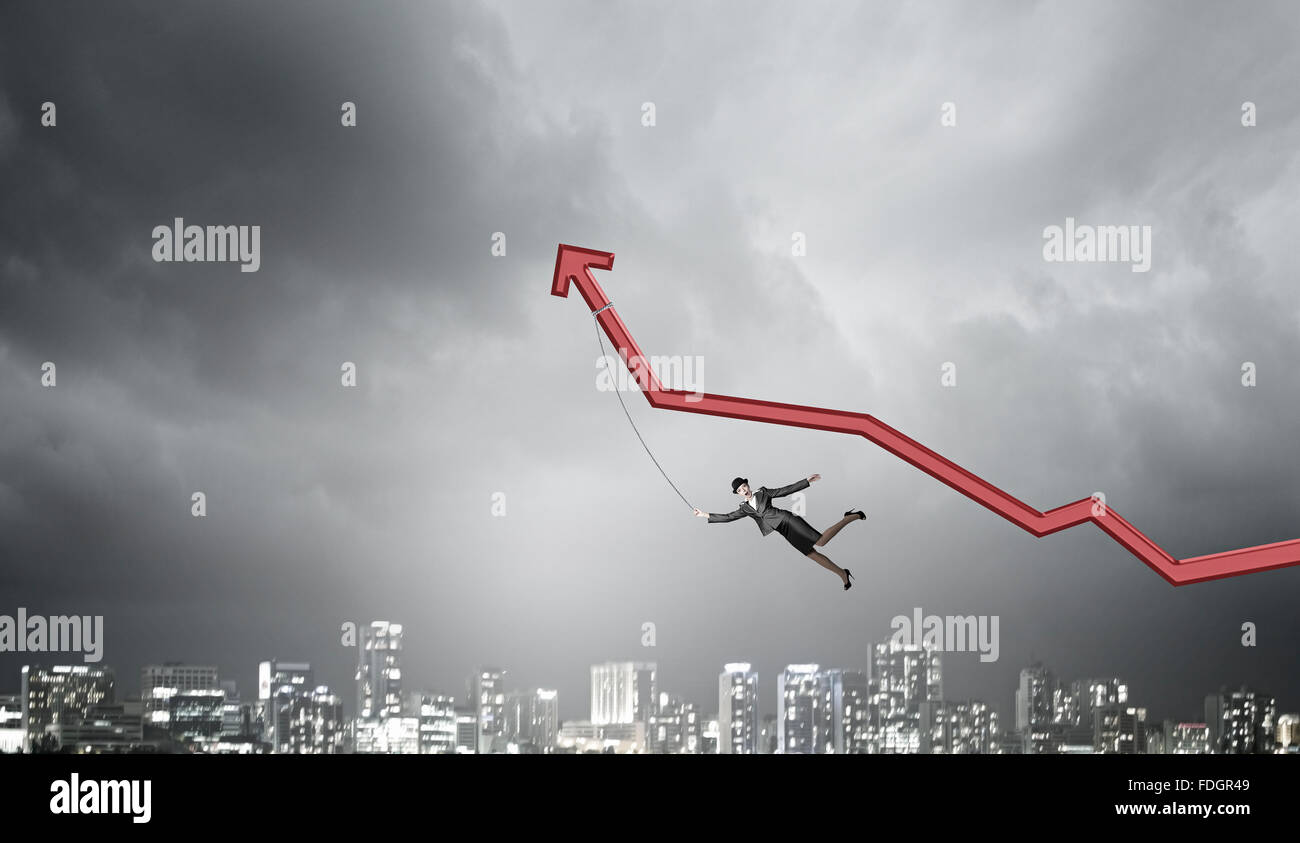 Businesswoman pulling arrow with rope and making it raise up Stock ...
