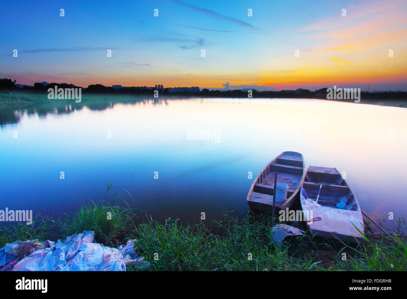 Sunset at pond Stock Photo - Alamy