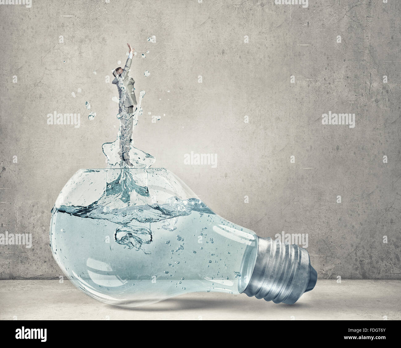 Glass light bulb filled with clear water and businessman inside Stock ...